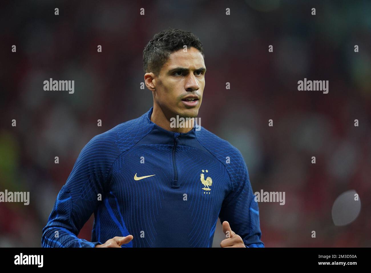 DOHA, QATAR - DECEMBER 14: Player of France Raphaël Varane warms up ...
