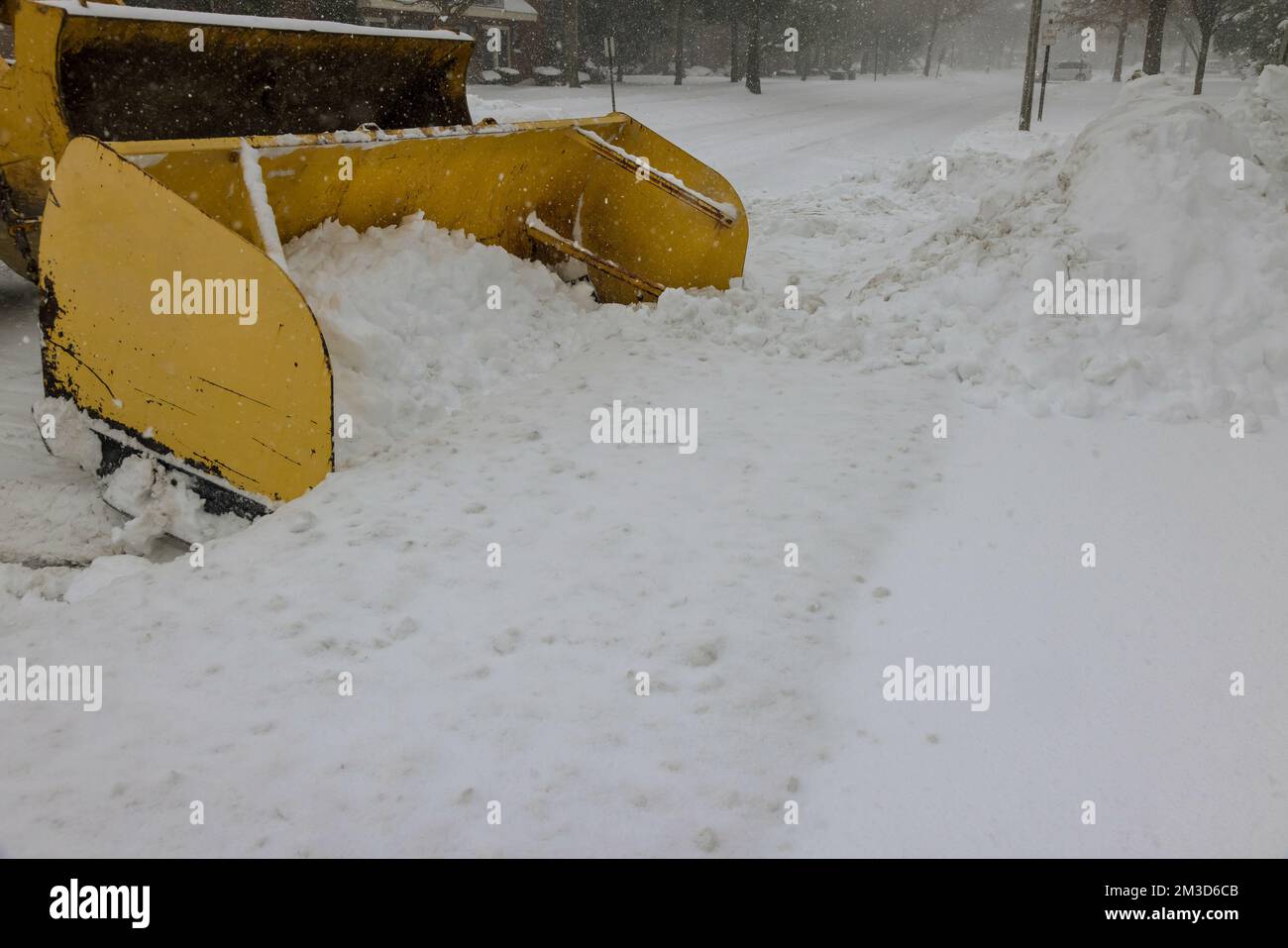 Clean up of snow with tractor after big snowstorm in winter after snow ...