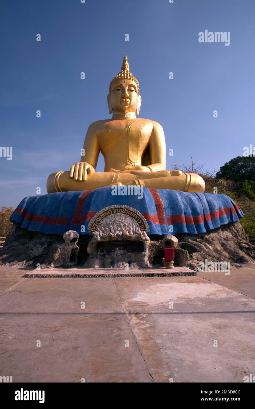Outdoor Sitting golden Buddha statue with a top of mountain on Wat Khao ...