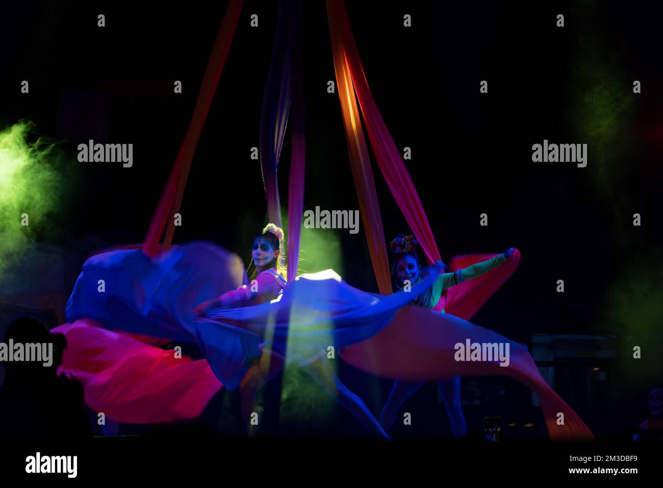 Professional Aerialist Circus Performer On Red Bright Aerial Silks