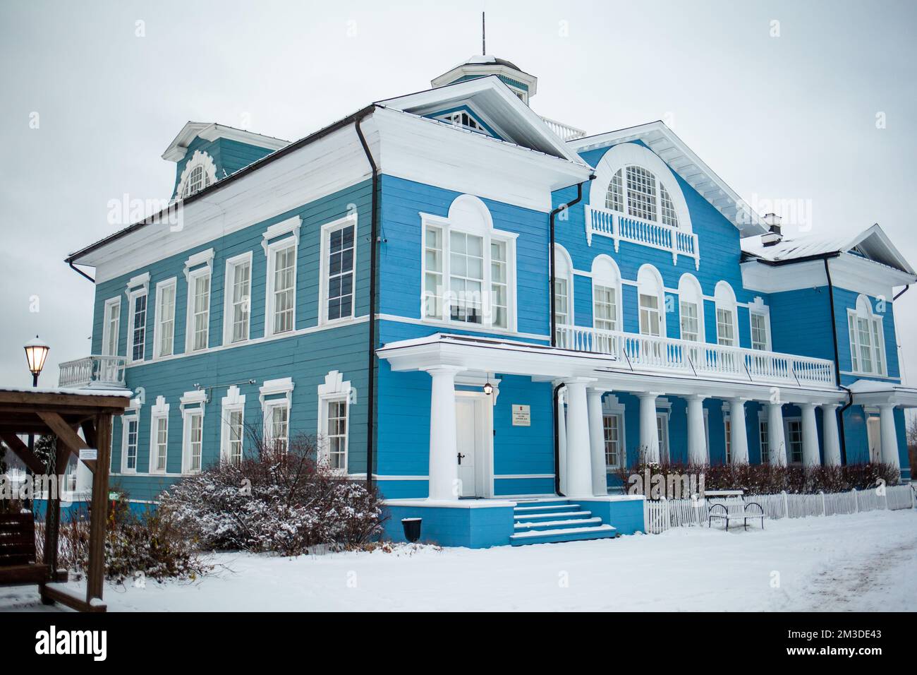 An old beautiful mansion with a wooden veranda, built in the 19th ...