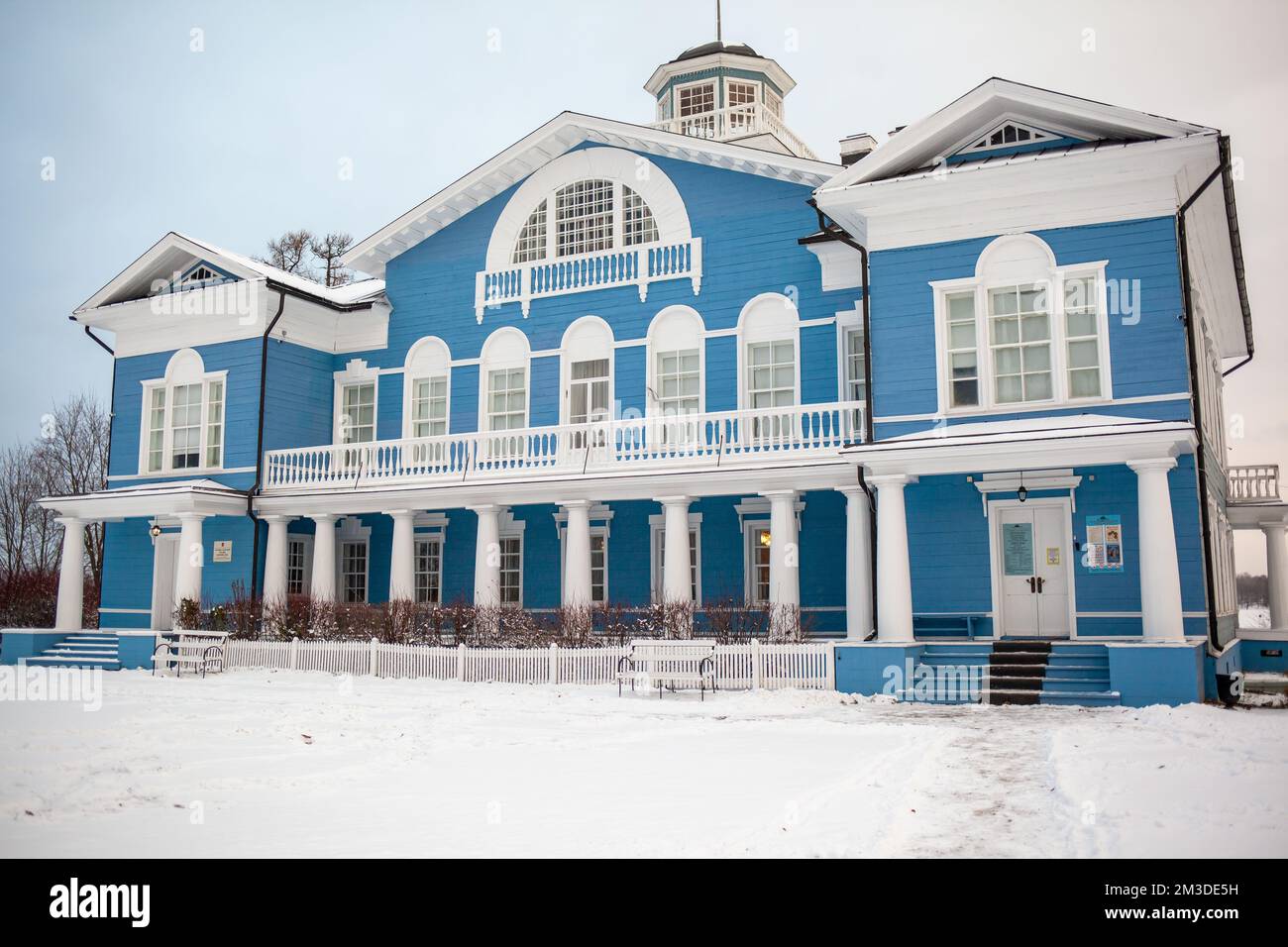 An old beautiful mansion with a wooden veranda, built in the 19th ...