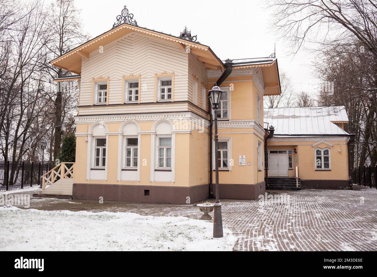 An old beautiful mansion with a wooden veranda, built in the 19th ...