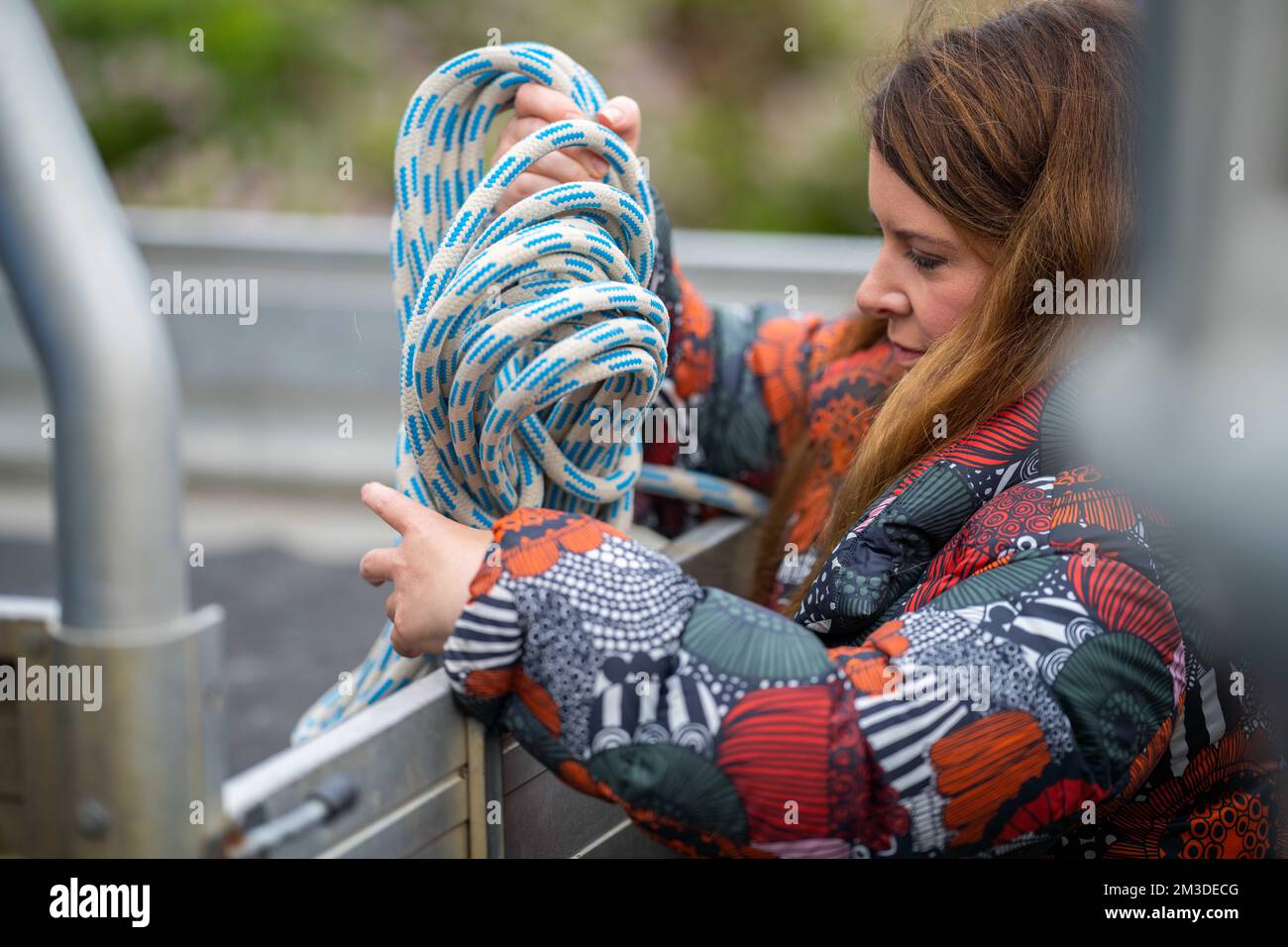 woman worker working with rope and cord on a ute in australia Stock ...
