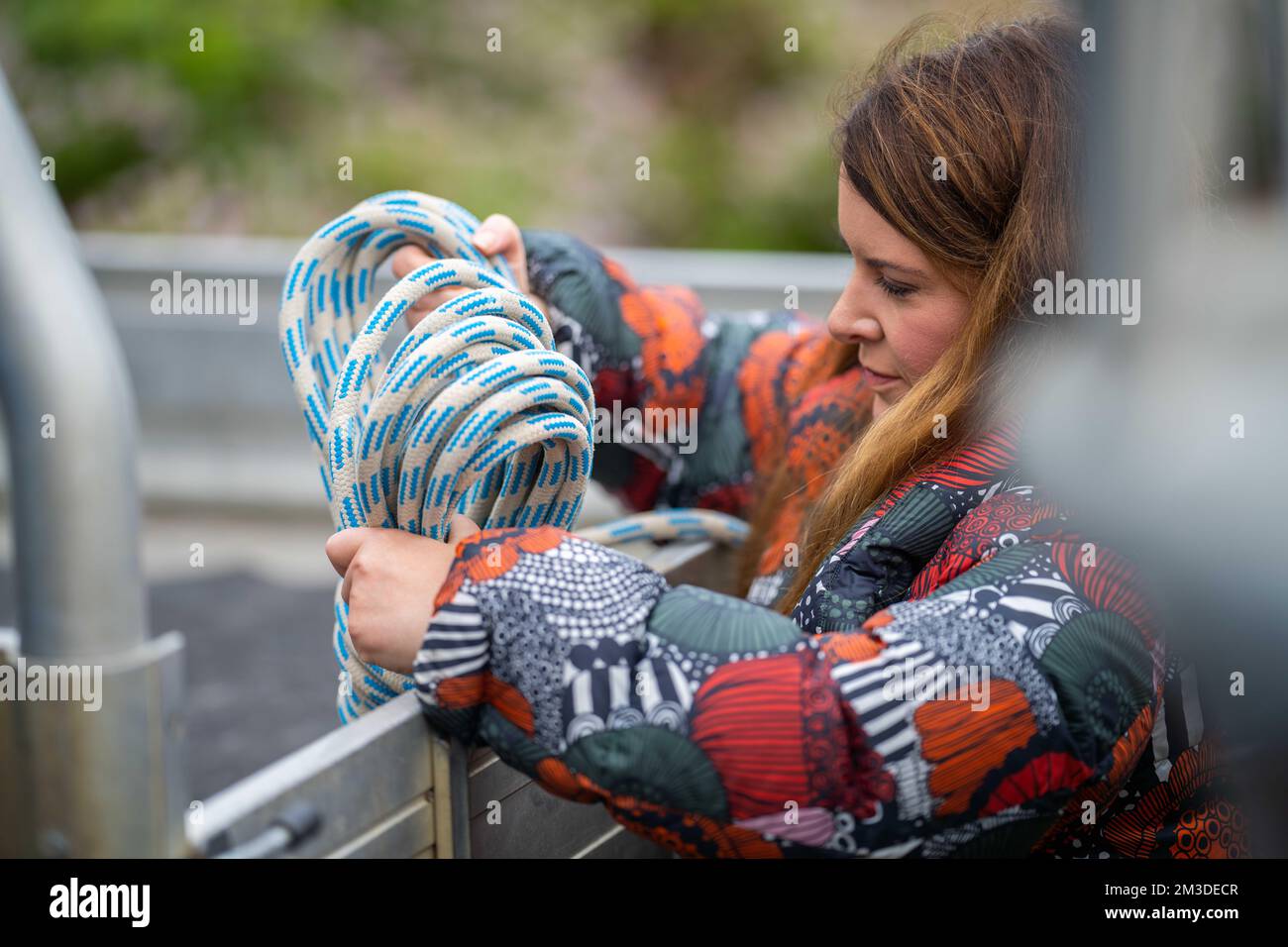 woman worker working with rope and cord on a ute in australia Stock ...