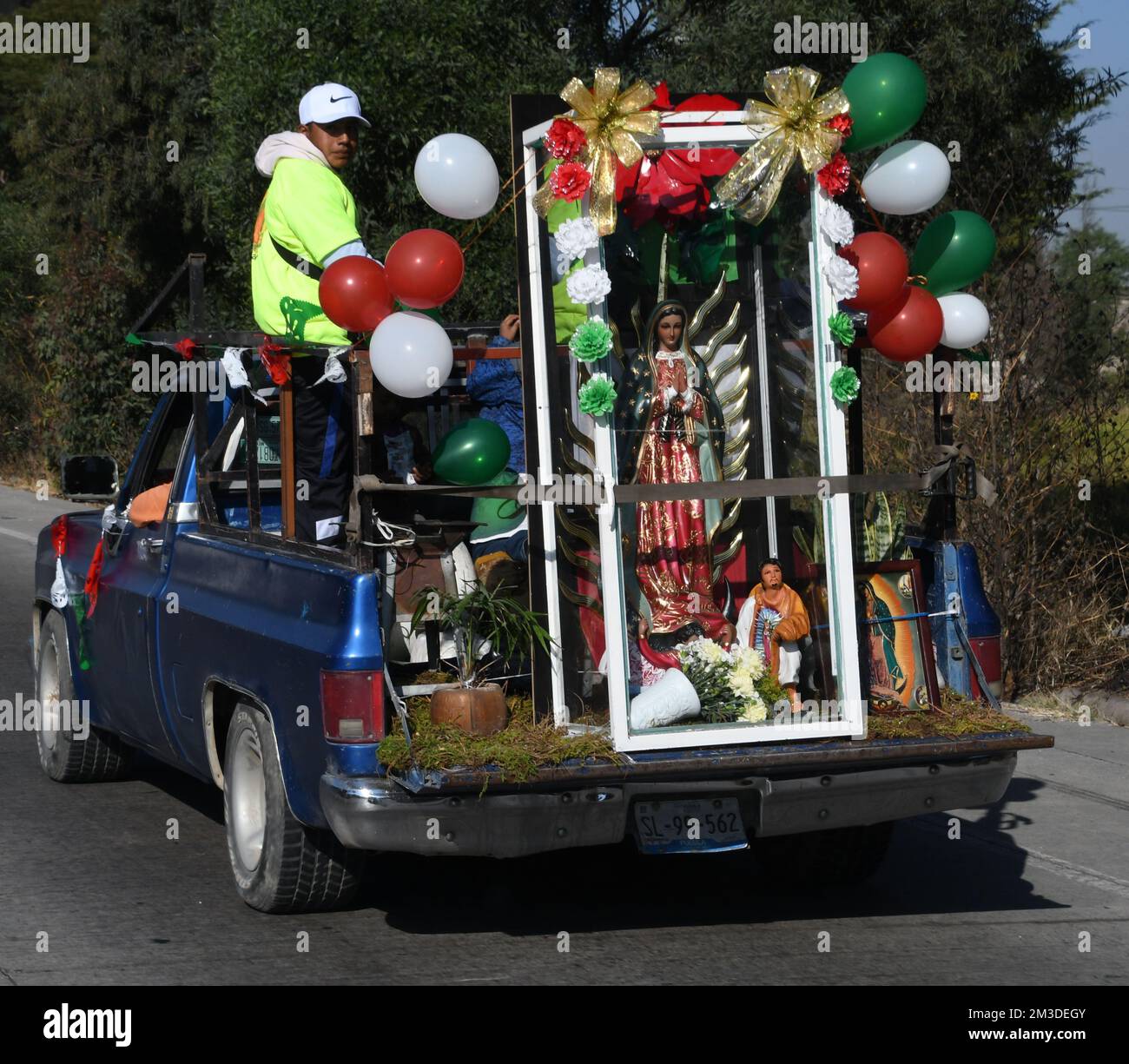 Puebla, USA. 11th Dec, 2022. Pilgrims on bicycle or in cars and trucks ...