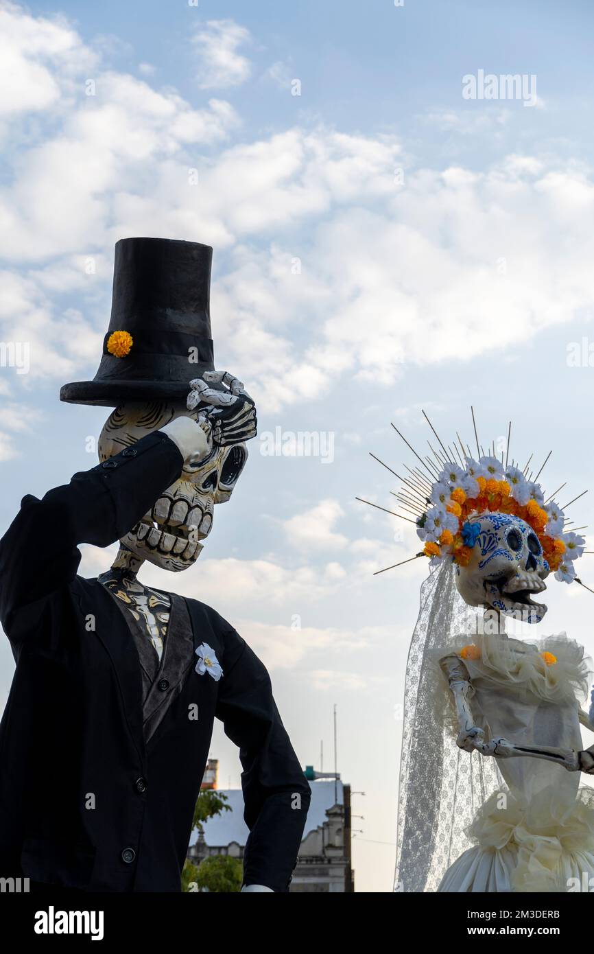 day of the dead parade with modified cars, people playing instruments ...