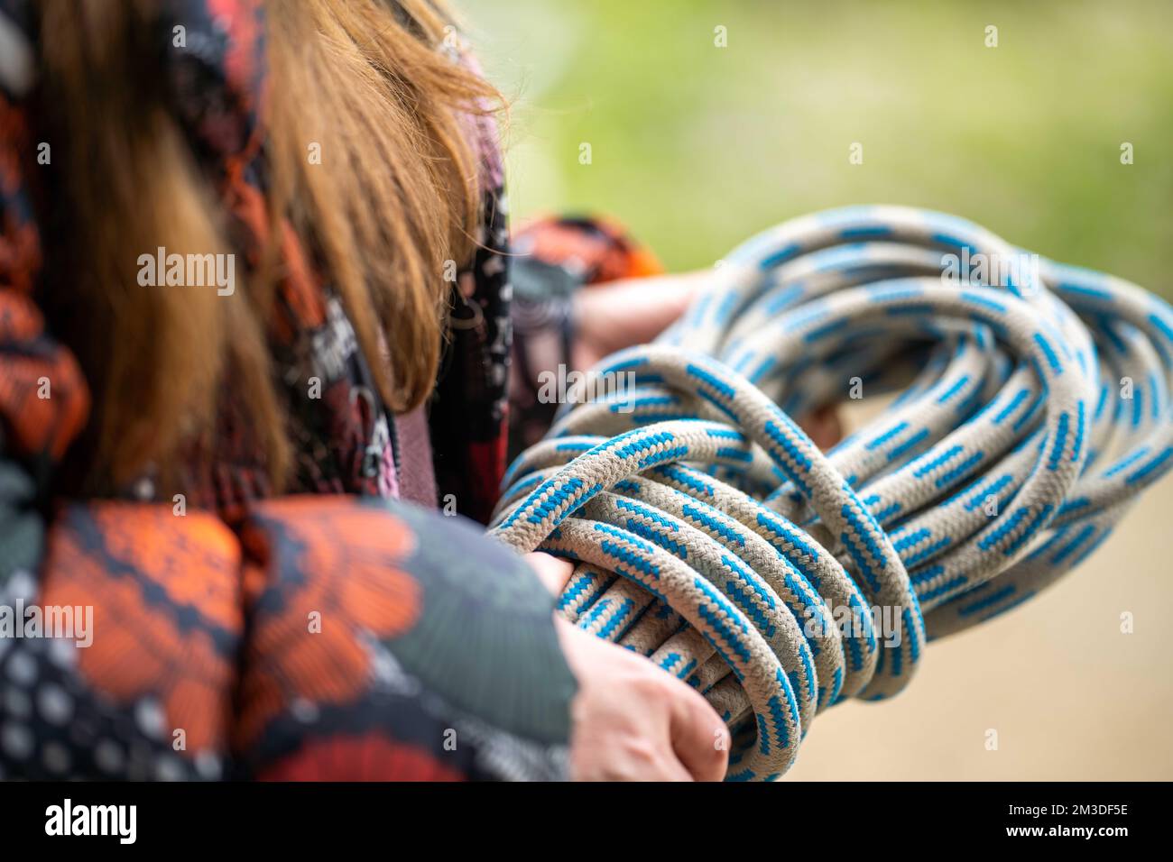 girl holding rope on a work site in american in summer Stock Photo - Alamy