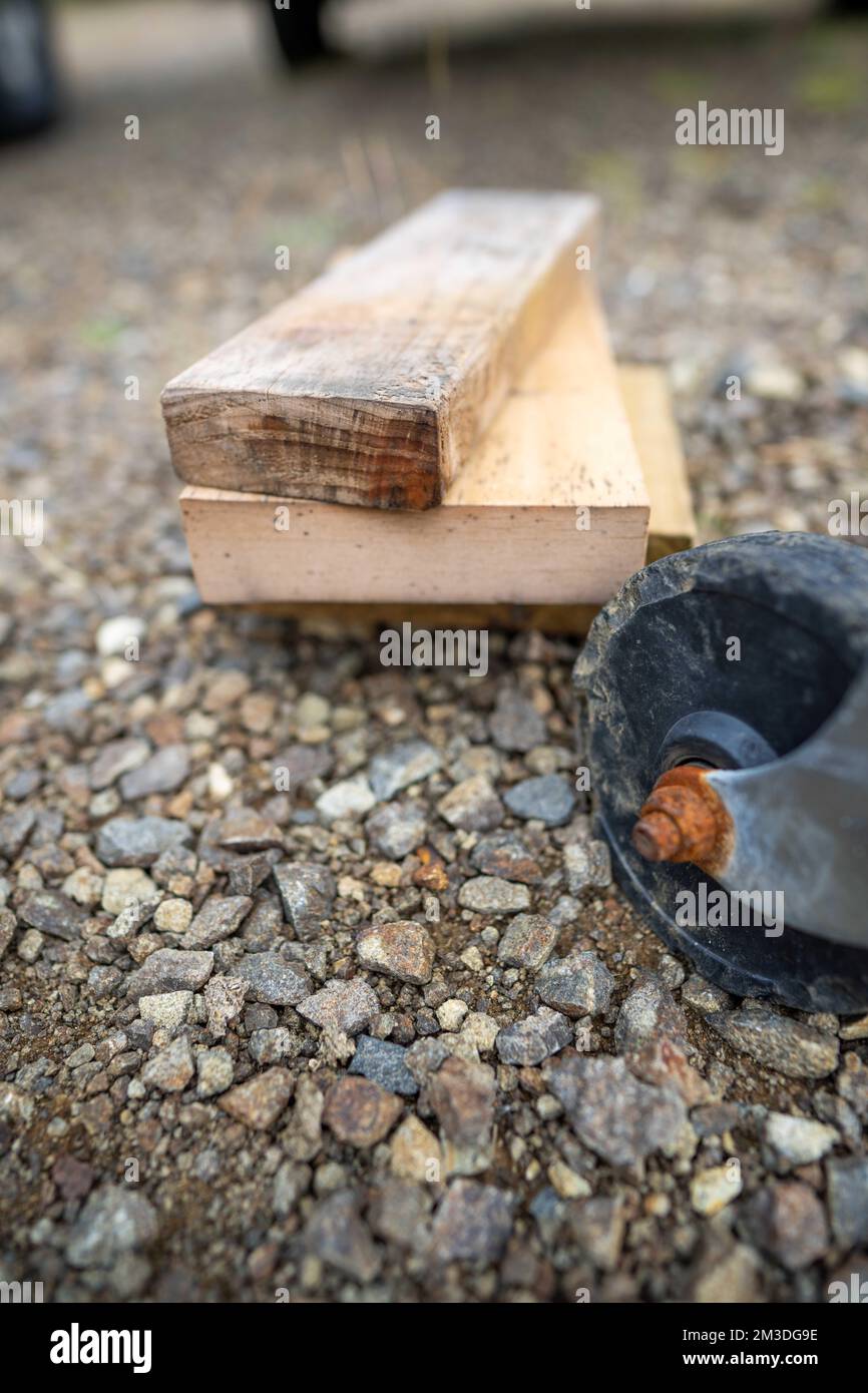 tyre blocks for a trailer in a park for camping Stock Photo - Alamy