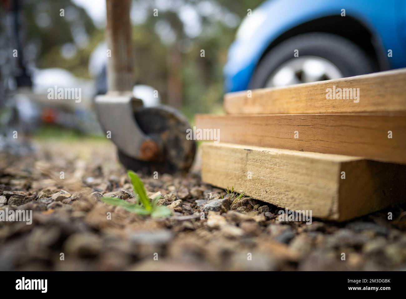 tyre blocks for a trailer in a park for camping Stock Photo - Alamy