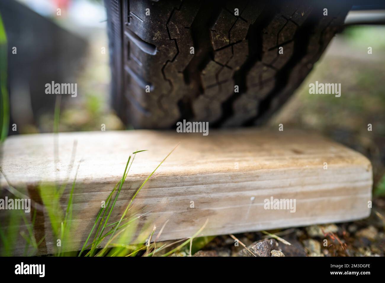 tyre blocks for a trailer in a park for camping Stock Photo - Alamy