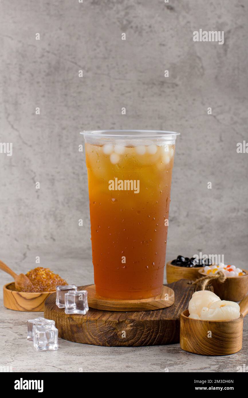 Boba or tapioca pearls is taiwan bubble milk tea in plastic cup with ...