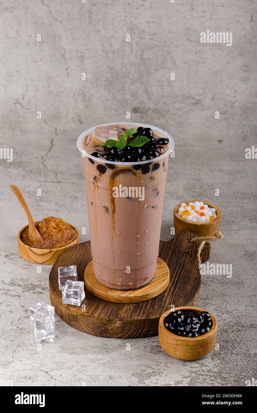Boba or tapioca pearls is taiwan bubble milk tea in plastic cup with ...