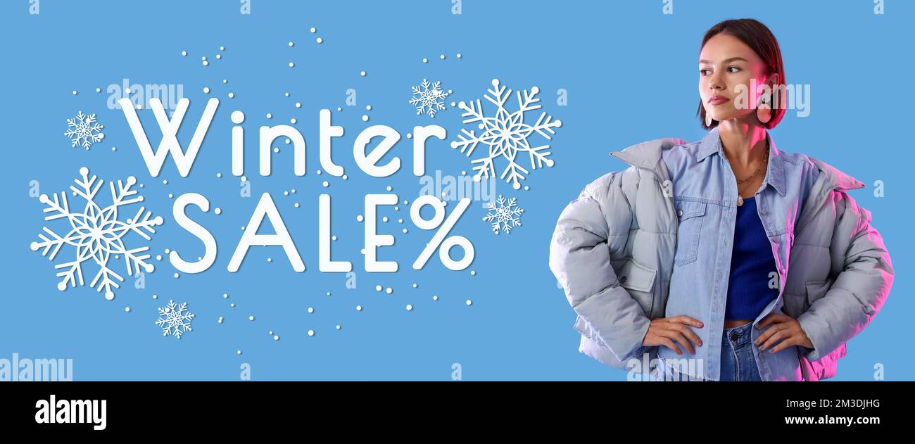 Pretty young woman in stylish warm clothes and text WINTER SALE on blue ...