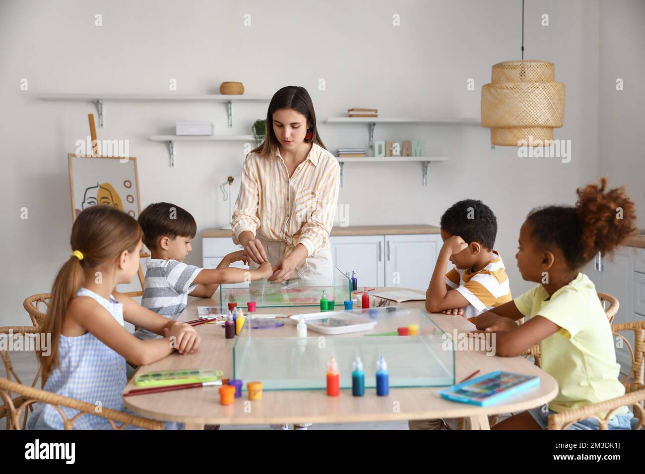 Little children during master class in Ebru painting at workshop Stock ...
