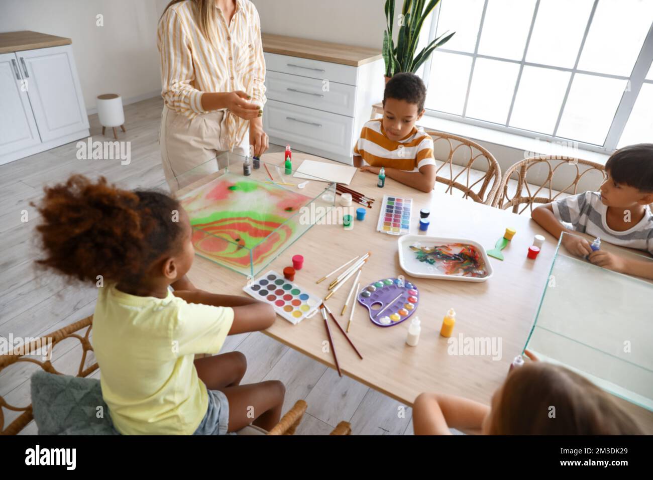 Little children during master class in Ebru painting at workshop Stock ...