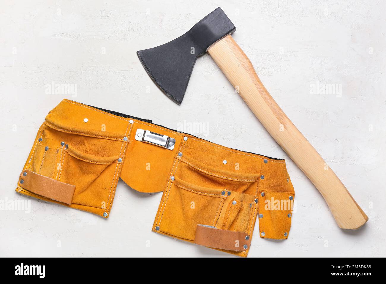Ax and tools belt on white background Stock Photo - Alamy