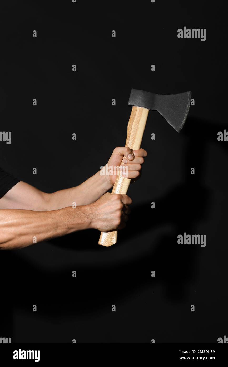 Man with ax on black background Stock Photo - Alamy