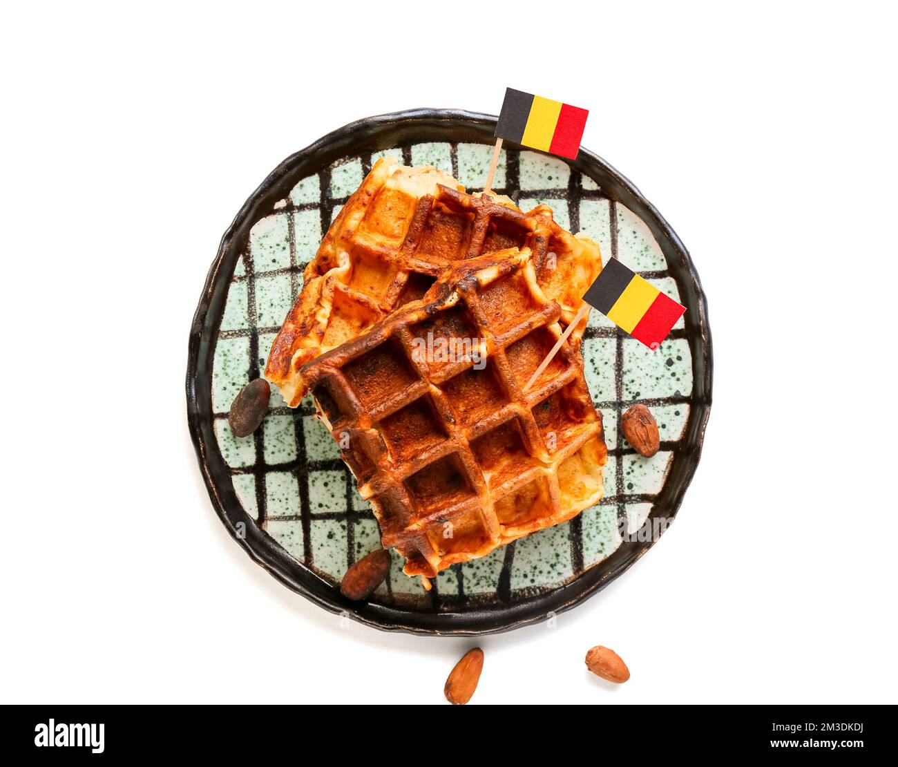 Plate with delicious Belgian waffles and small flags on white ...
