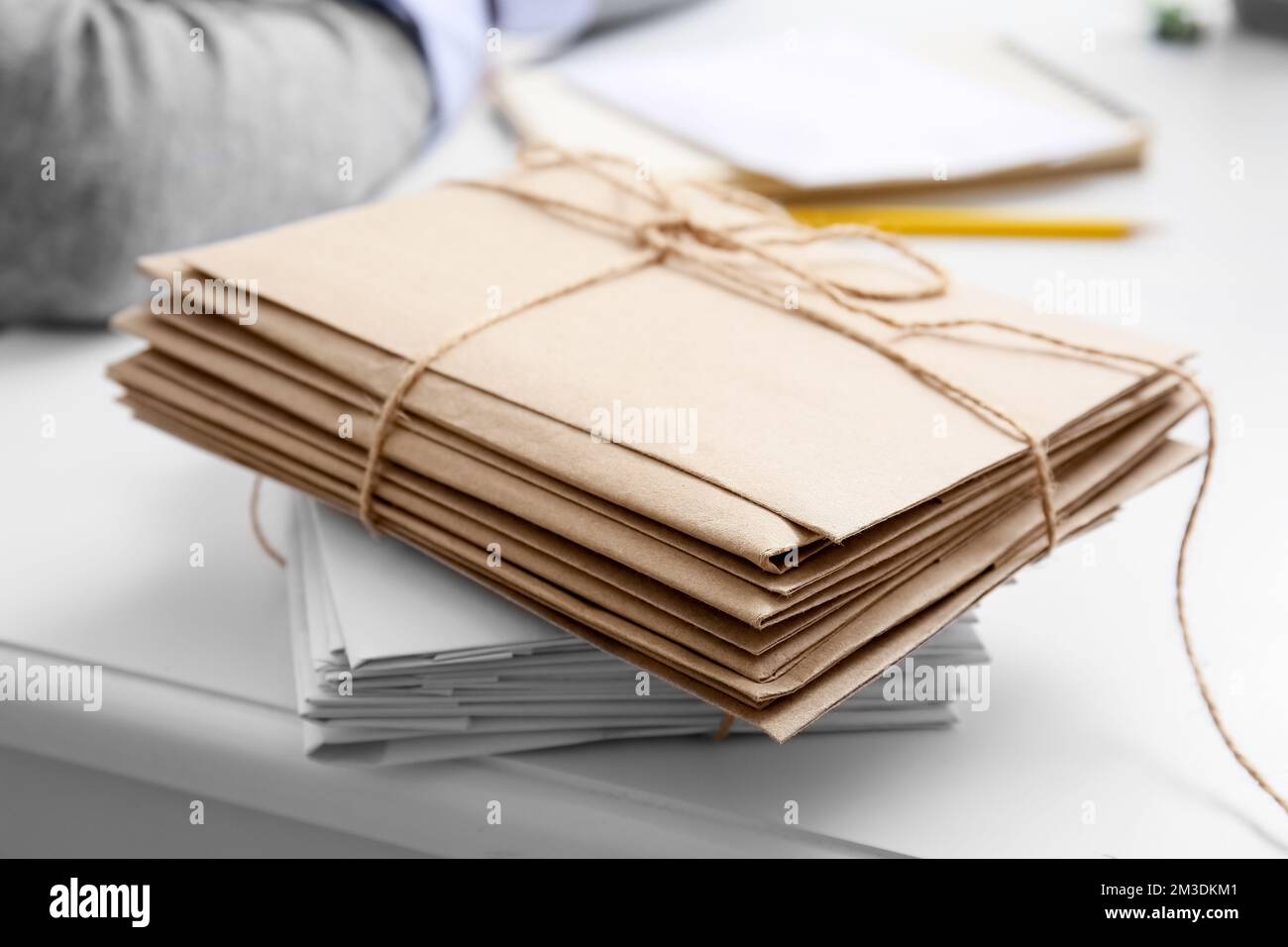 Closeup view of tied letters on table. Mail concept Stock Photo - Alamy