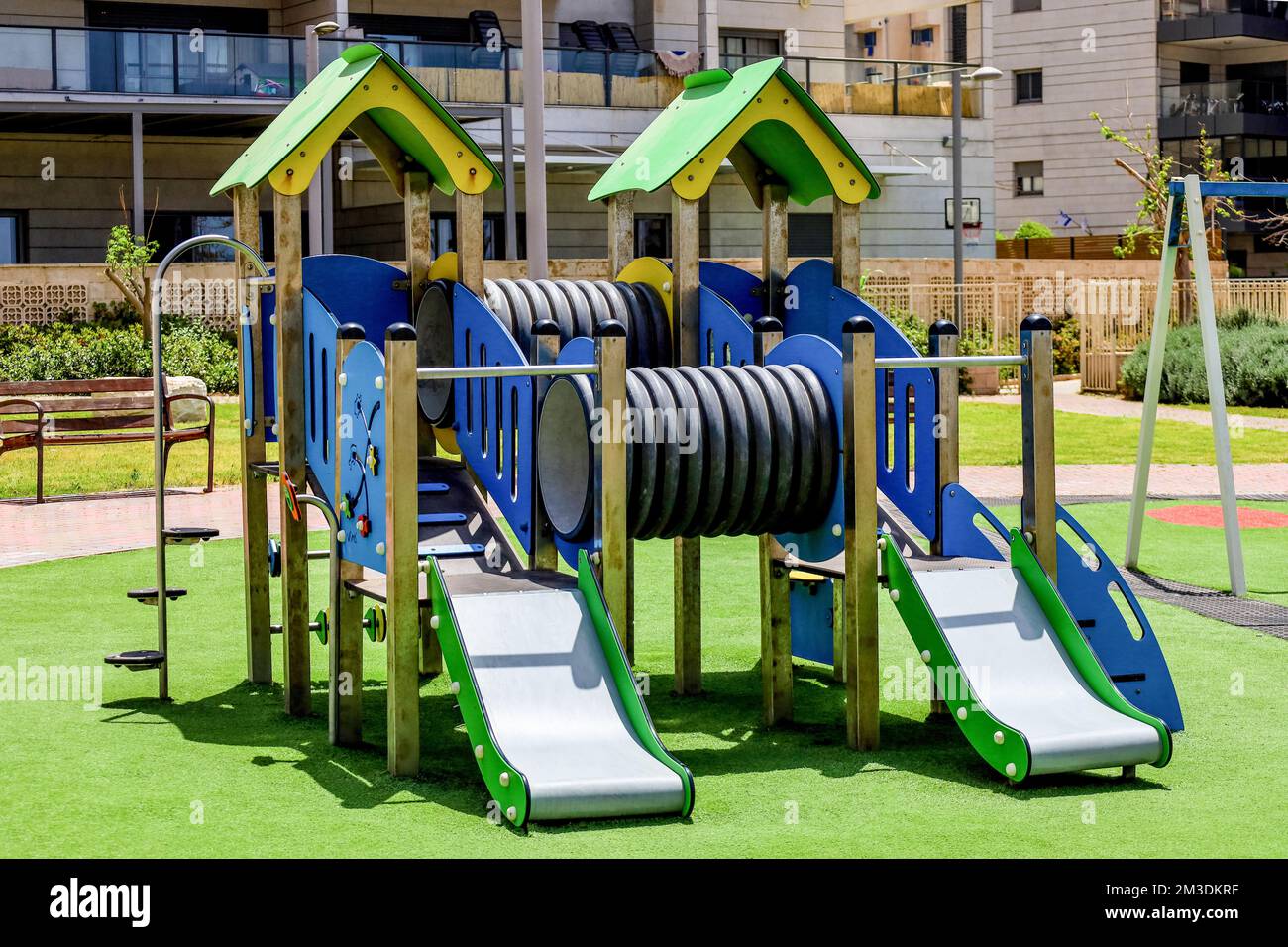View of children's playground with slides Stock Photo - Alamy