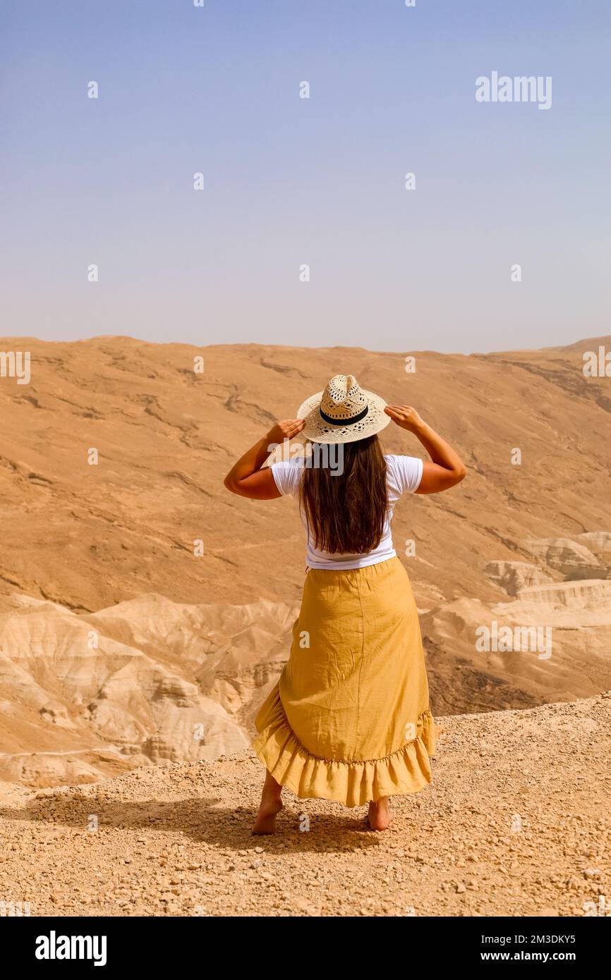 Young woman in desert, back view Stock Photo - Alamy