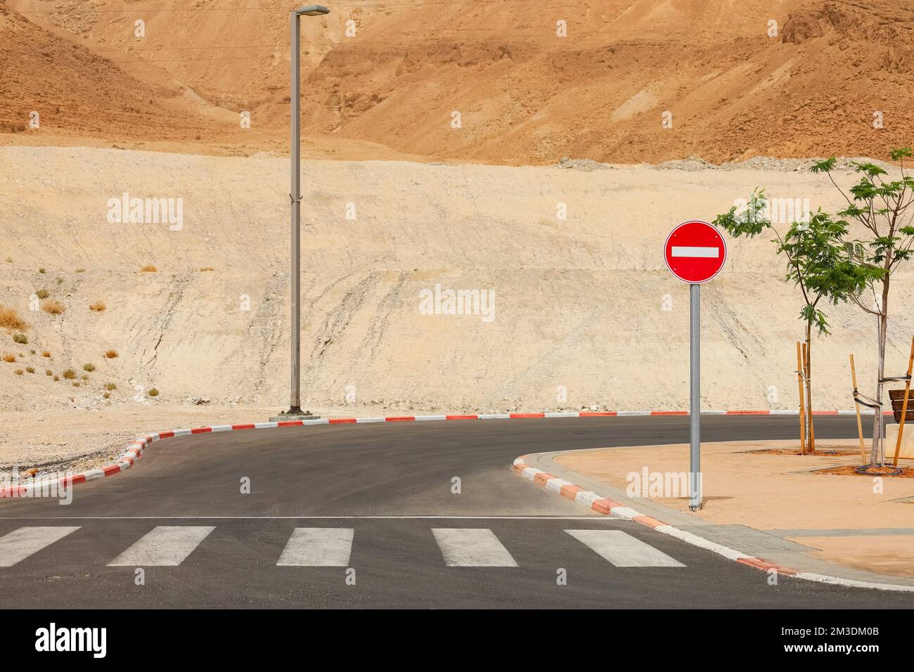 View of road with pedestrian crossing and No Entry sign in desert Stock ...
