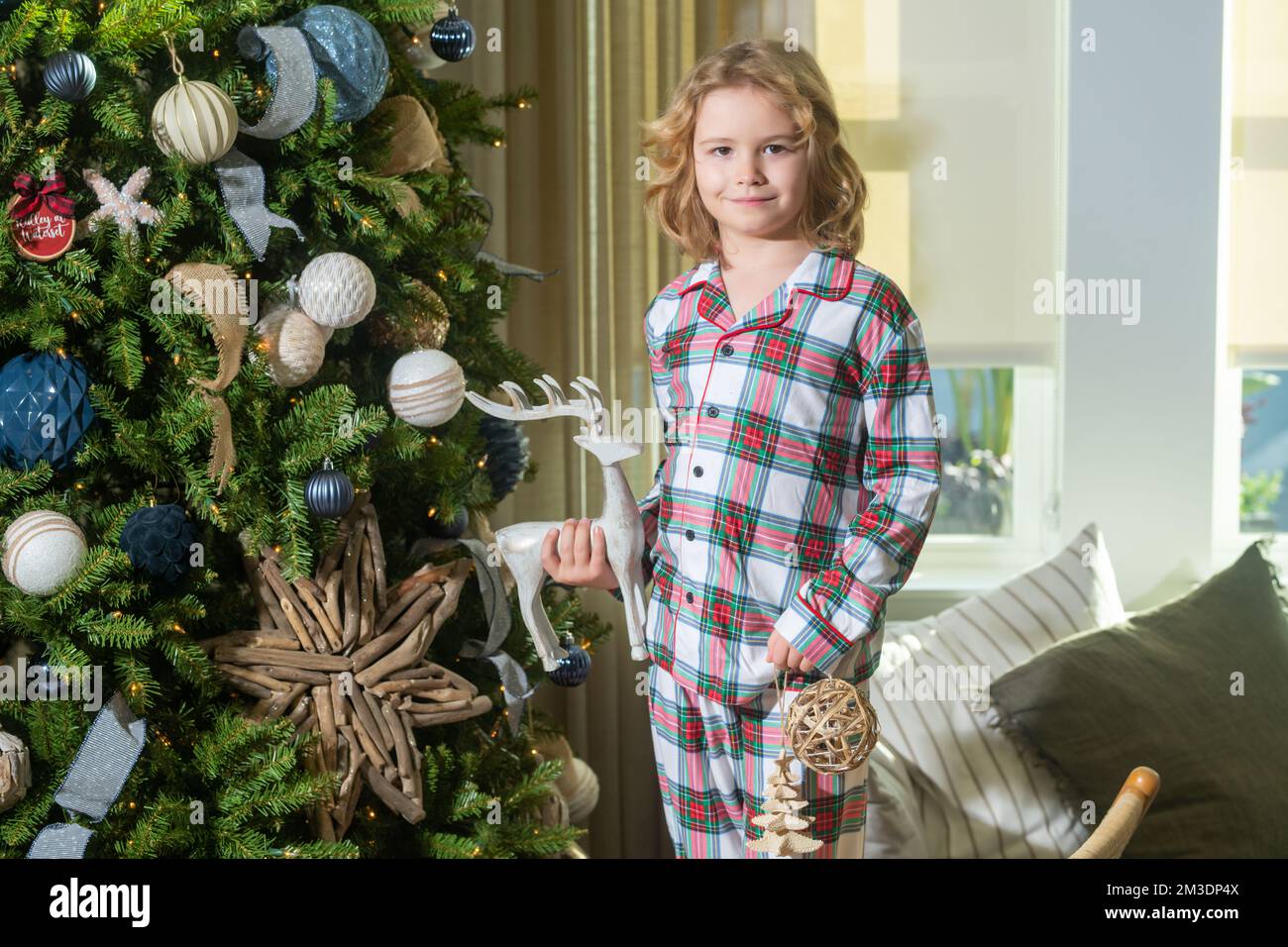 Merry Christmas. Child son preparing home for xmas celebration ...