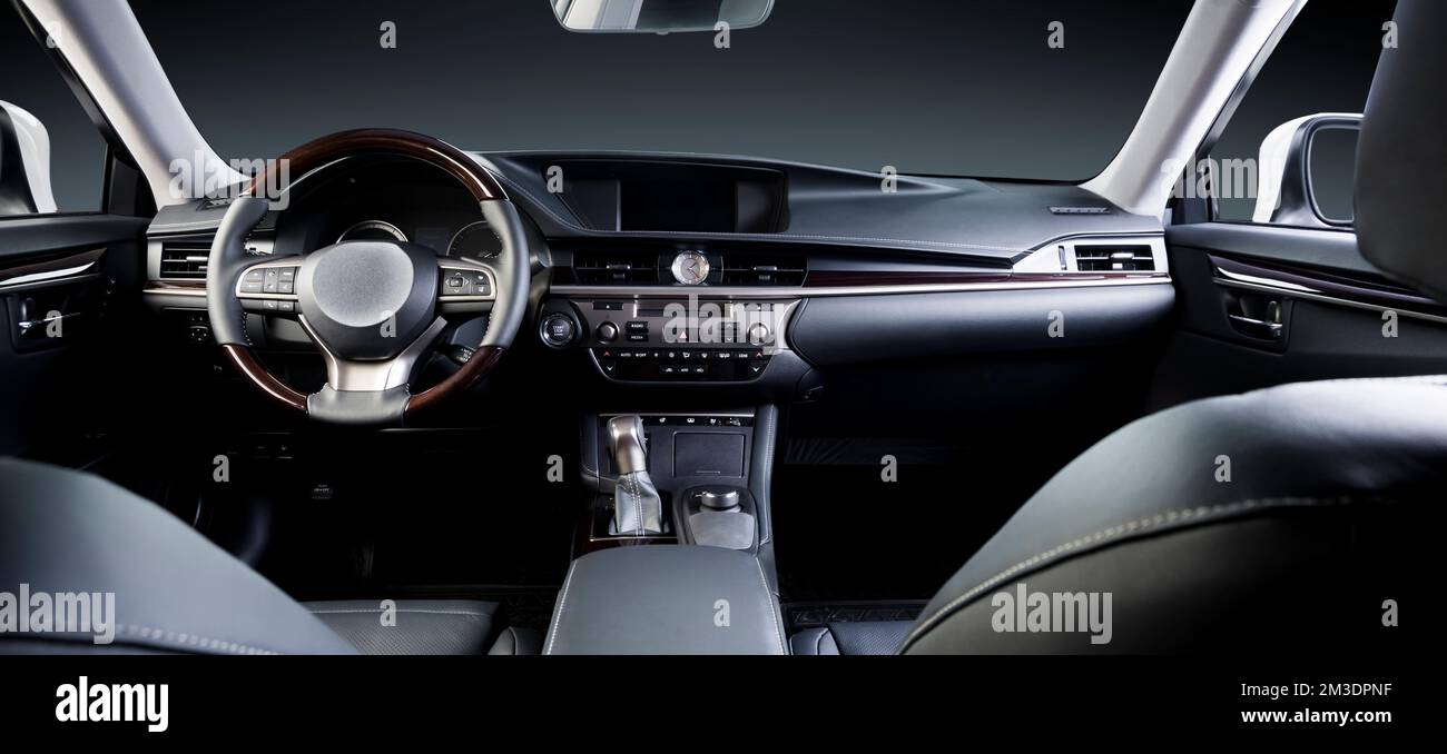 Dark luxury car Interior - steering wheel, shift lever and dashboard ...