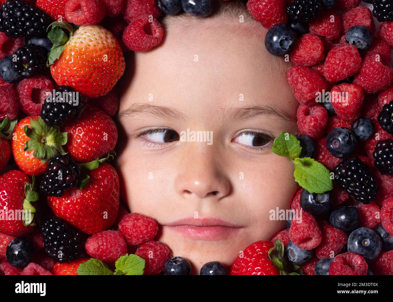 Funny fruits. Assorted mix of strawberry, blueberry, raspberry ...