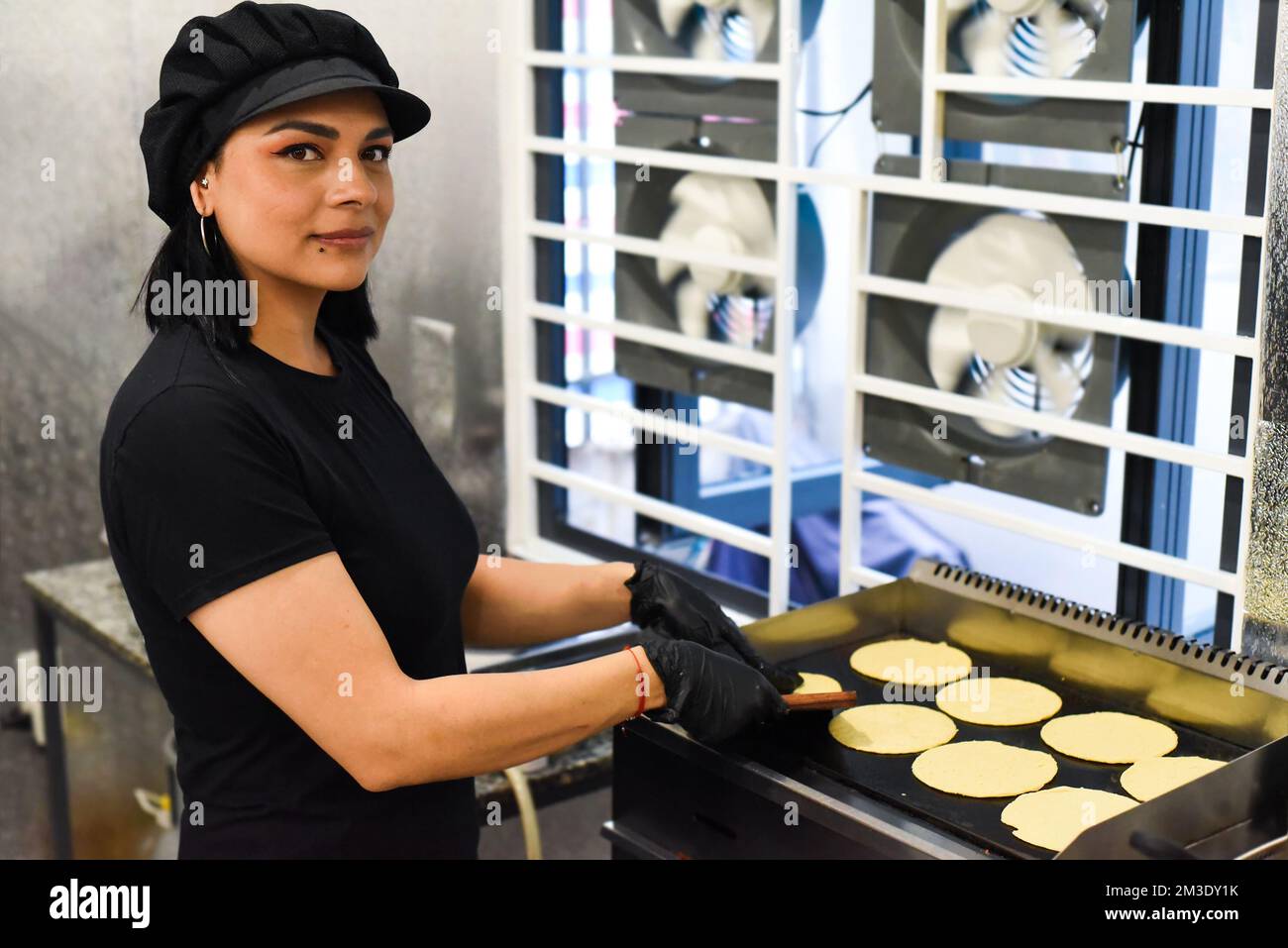 Mexican girl cooking hi-res stock photography and images - Alamy