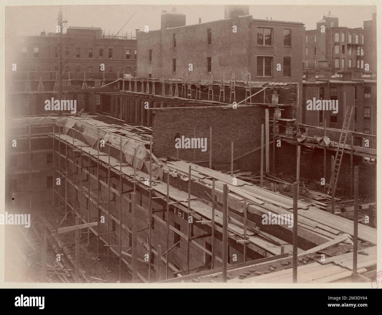 Laying brick, Courtyard west wall, construction of McKim Building ...
