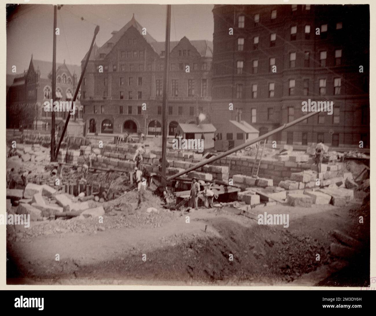 Laying granite blocks for foundation, construction of the McKim ...