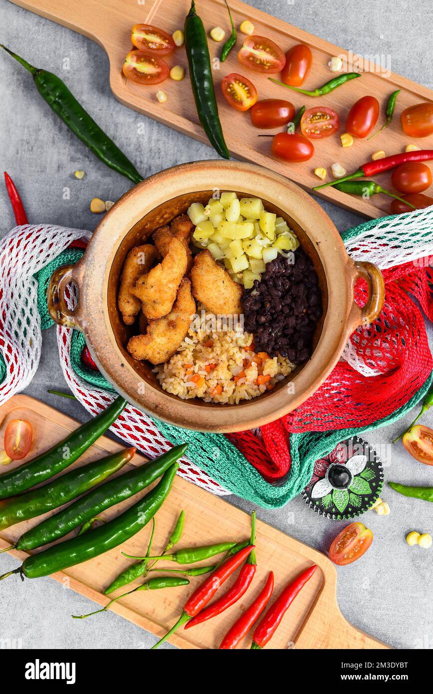 Mexican tradition dish Cazuela with fried chicken, beans rice and ...