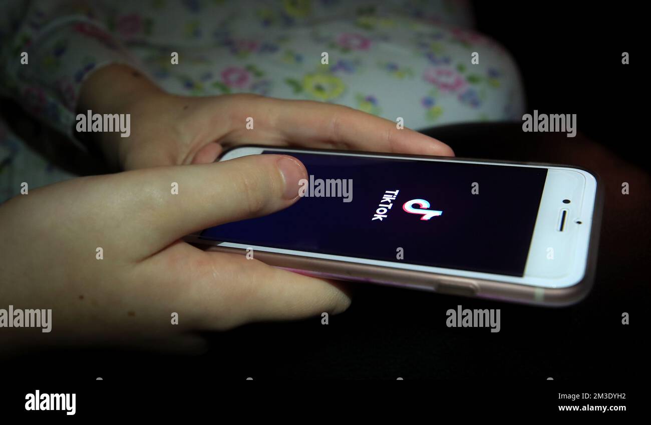 File photo dated 12/11/19 of a young person using the TikTok app on a ...