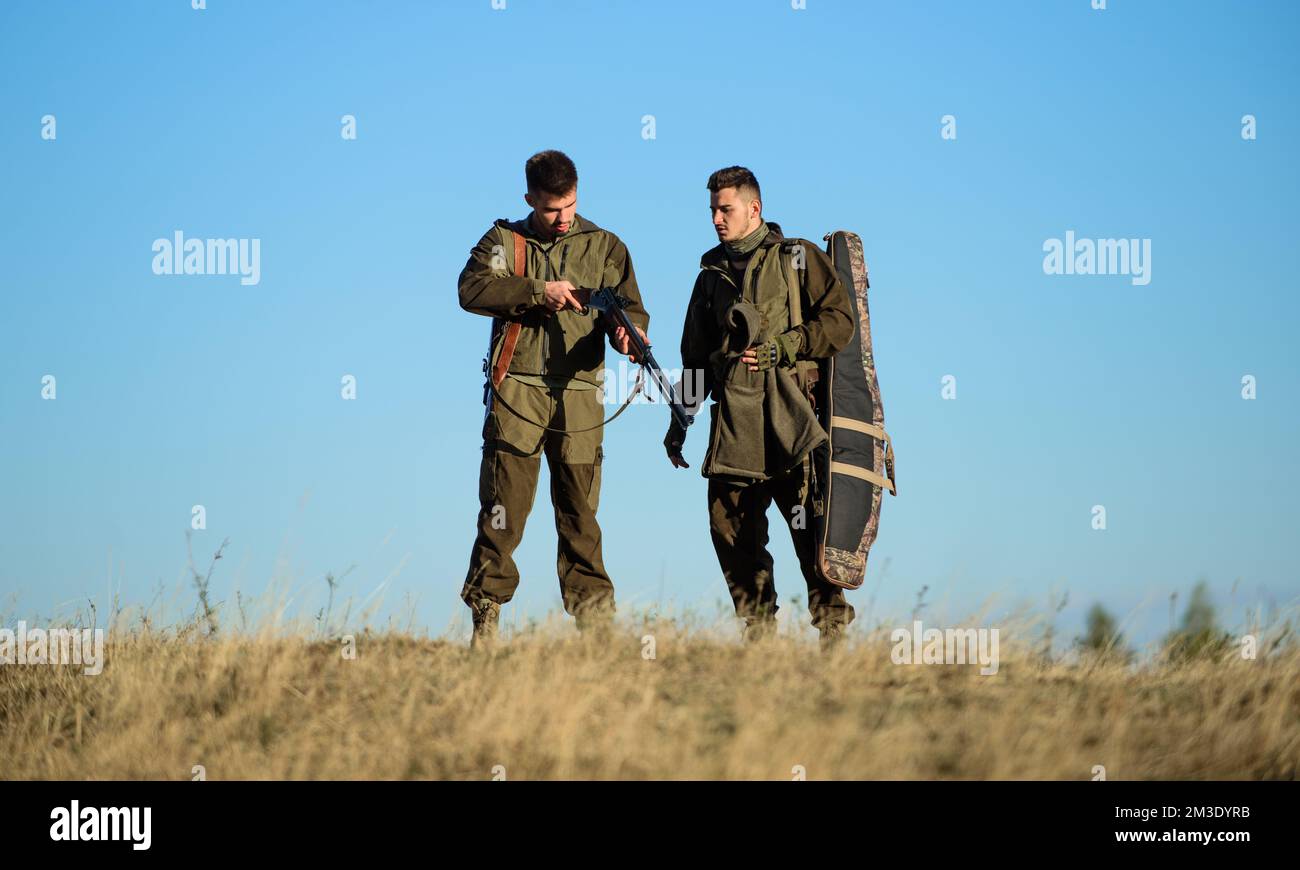 Hunter friend enjoy leisure in field. Hunting with friends hobby ...