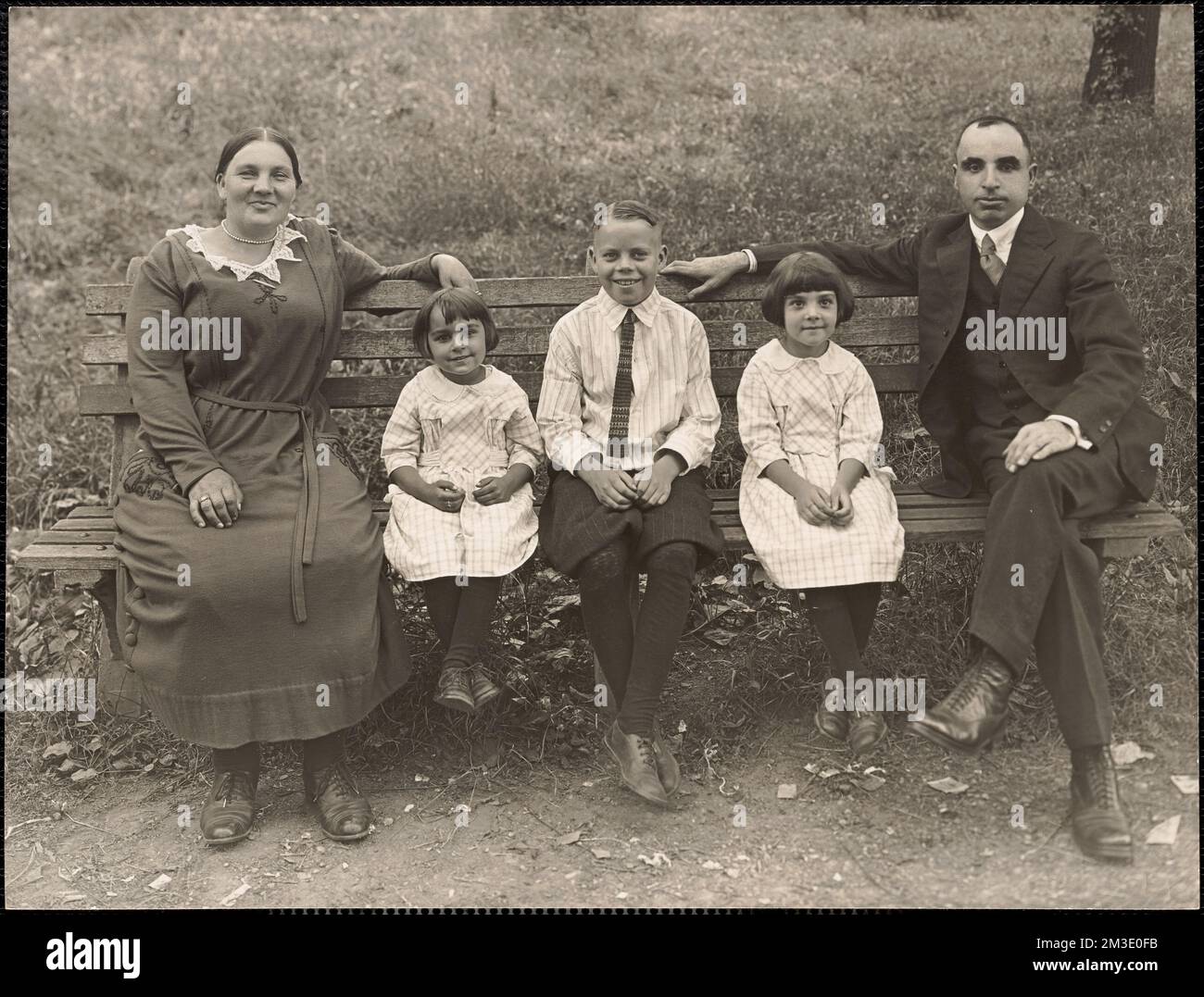 Leon, Alma, Herman, Lillian, and Marian Abdalian sitting on a bench ...