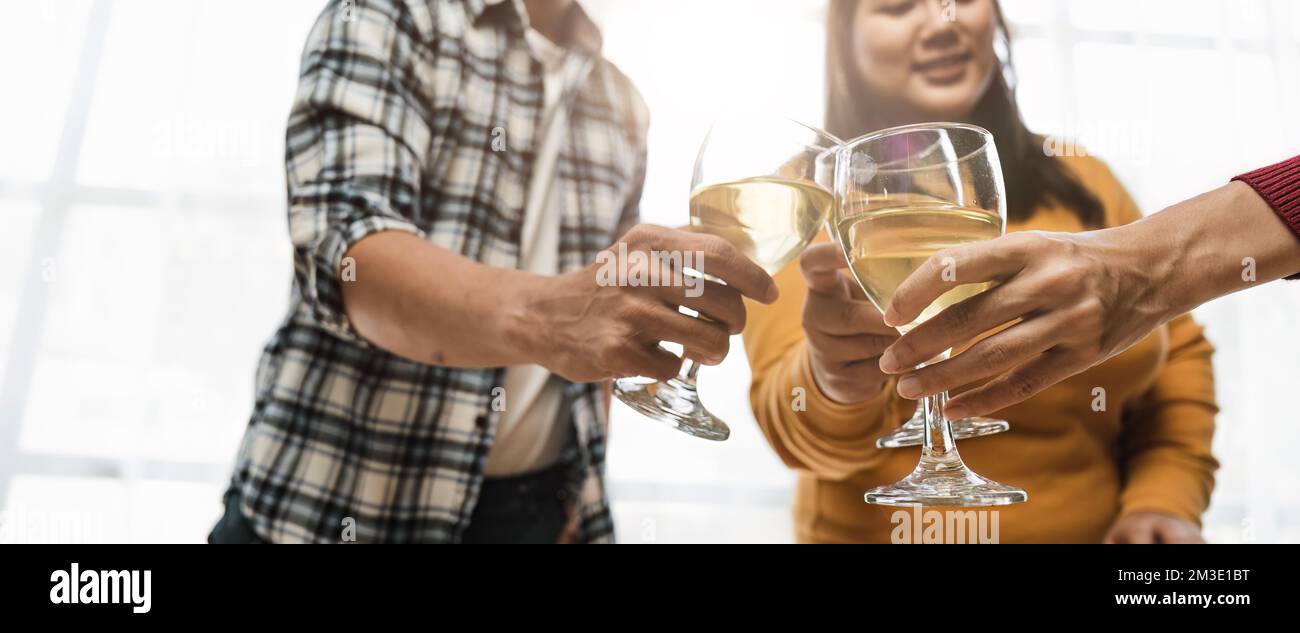 Group of happy colleagues having fun at a new year celebration or ...