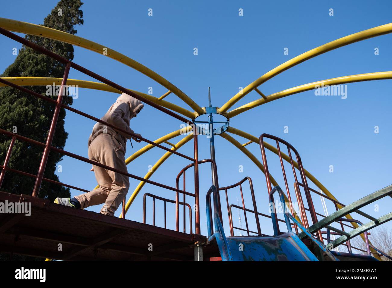 A Caucasian boy playing in playground Stock Photo - Alamy