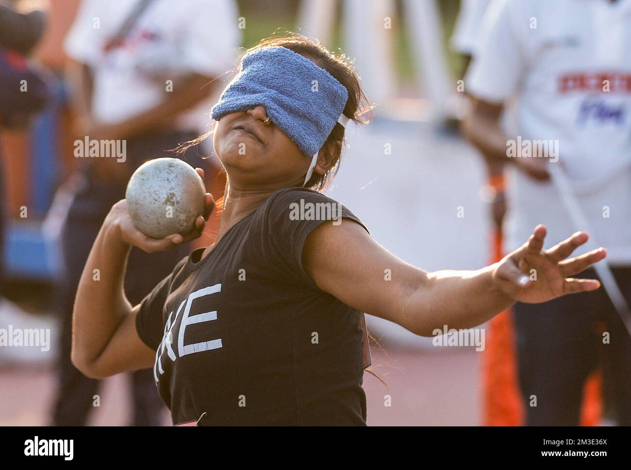 New Delhi, India. 14th Dec, 2022. A visually impaired athlete throws a ...