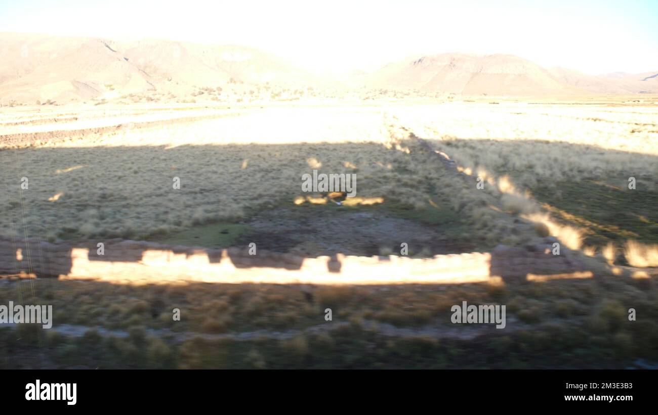 Shadow of a driving Train in Desert blue sky mountains Stock Photo - Alamy