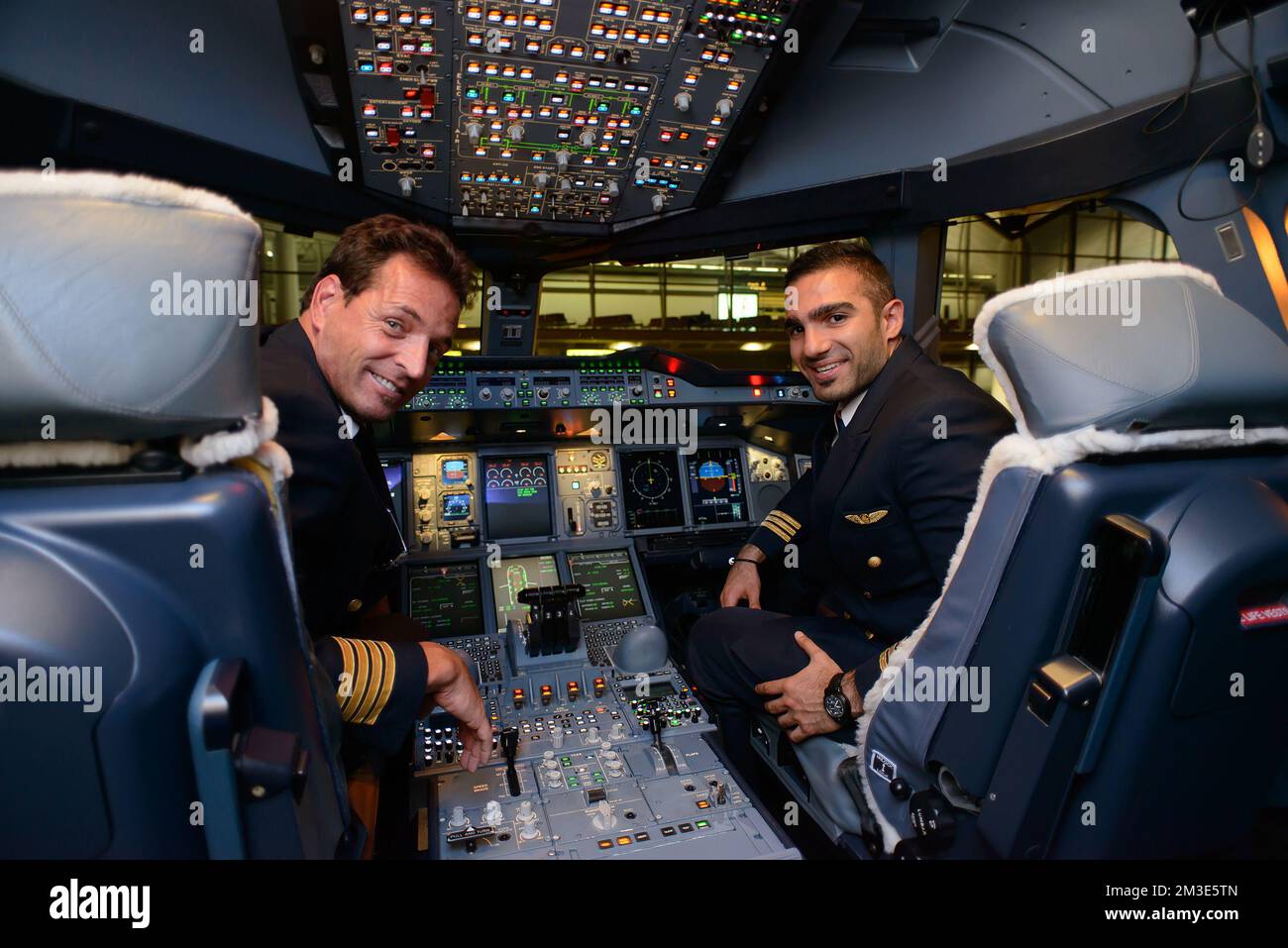 HONG KONG, CHINA - MAY 16, 2014: pilots in Emirates Airbus A380 ...