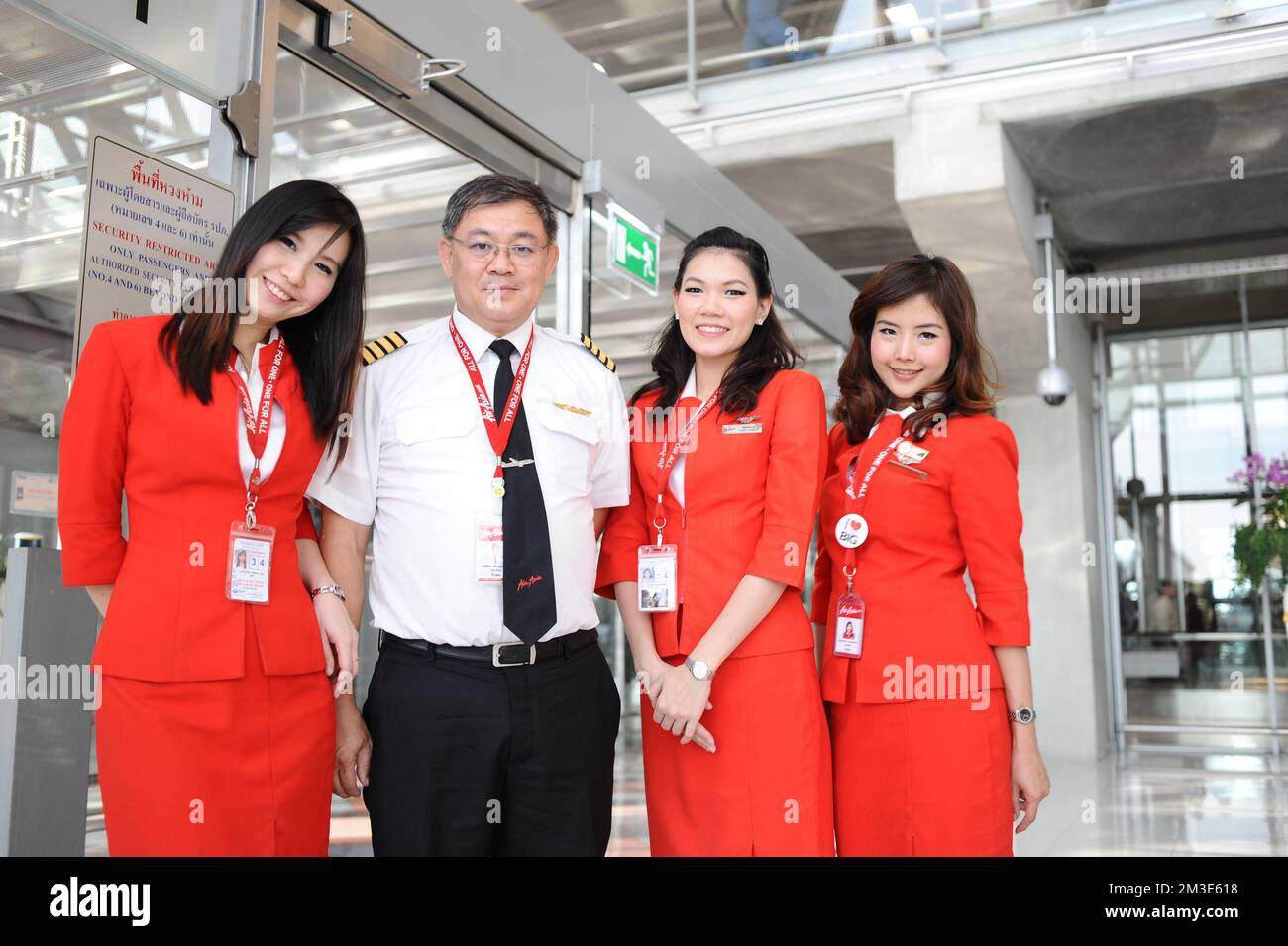 BANGKOK - OCT 27: Airasia crew members in Bangkok Airport on October 27 ...