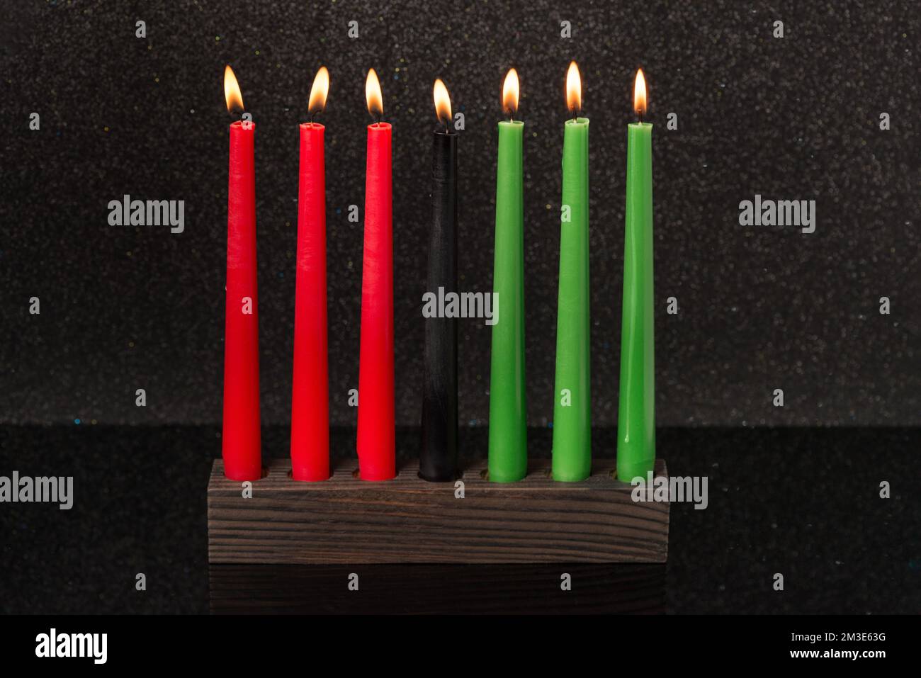 Kwanzaa festival concept with seven candles red, black and green in ...
