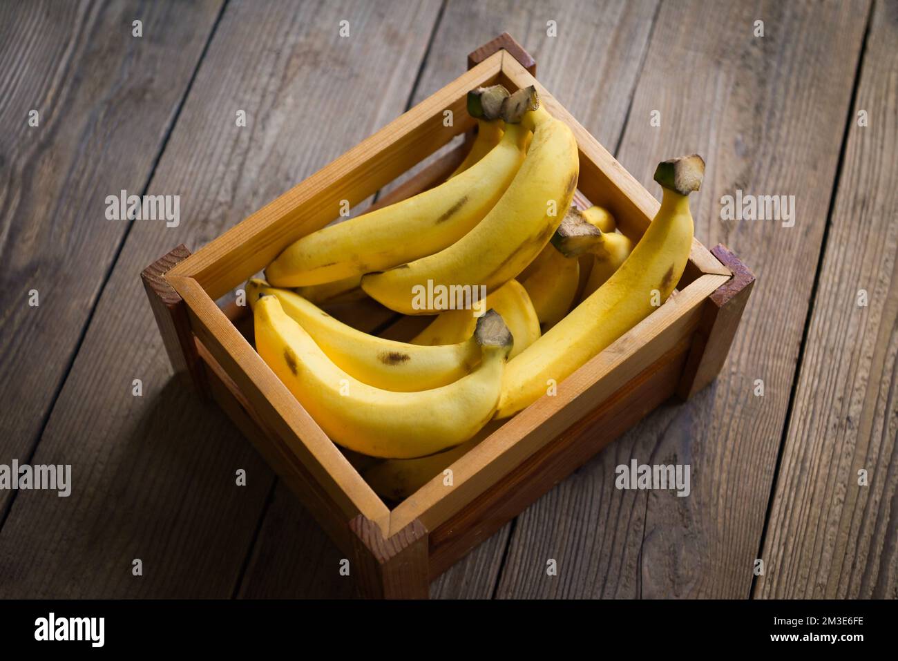 bunch of bananas - banana on wooden box background, ripe banana fruit ...