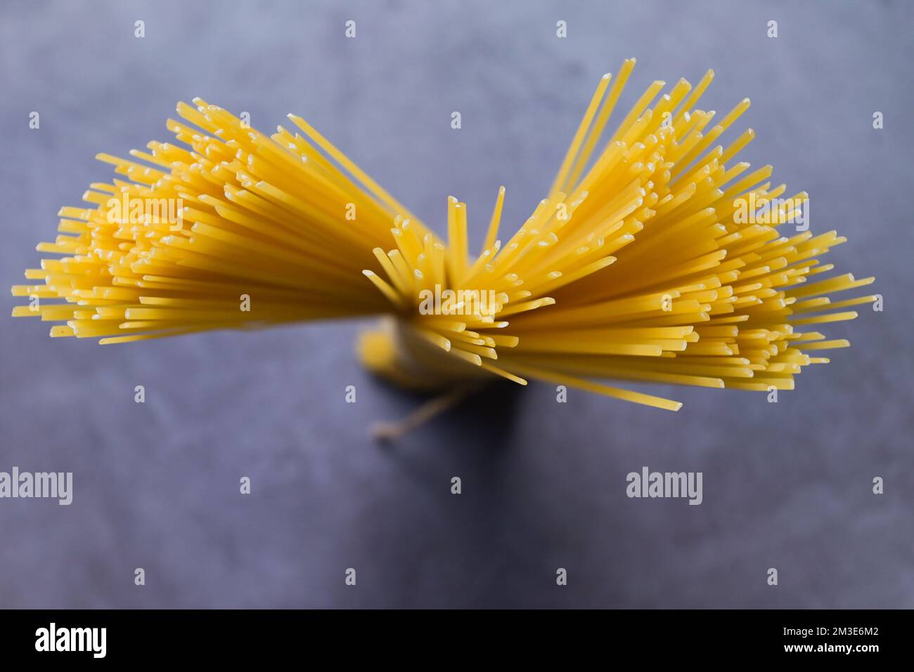 Raw spaghetti pasta uncooked, spaghetti noodles on dark background, raw ...
