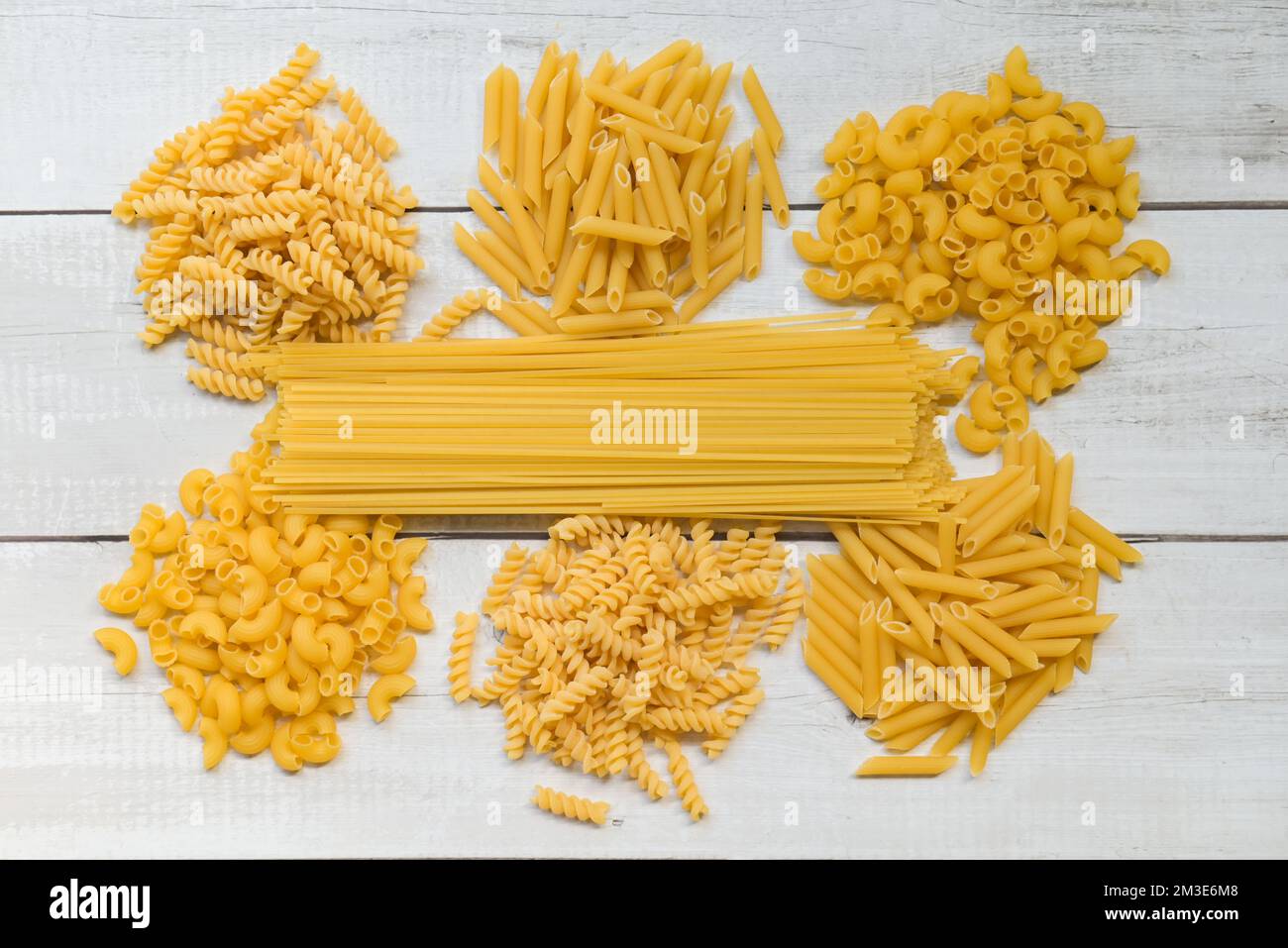 Raw pasta various kinds of uncooked pasta macaroni spaghetti and ...