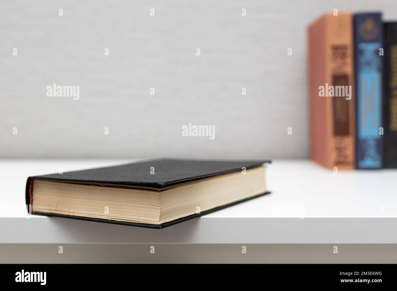 a closed book lies on the table. book on the table. . High quality ...