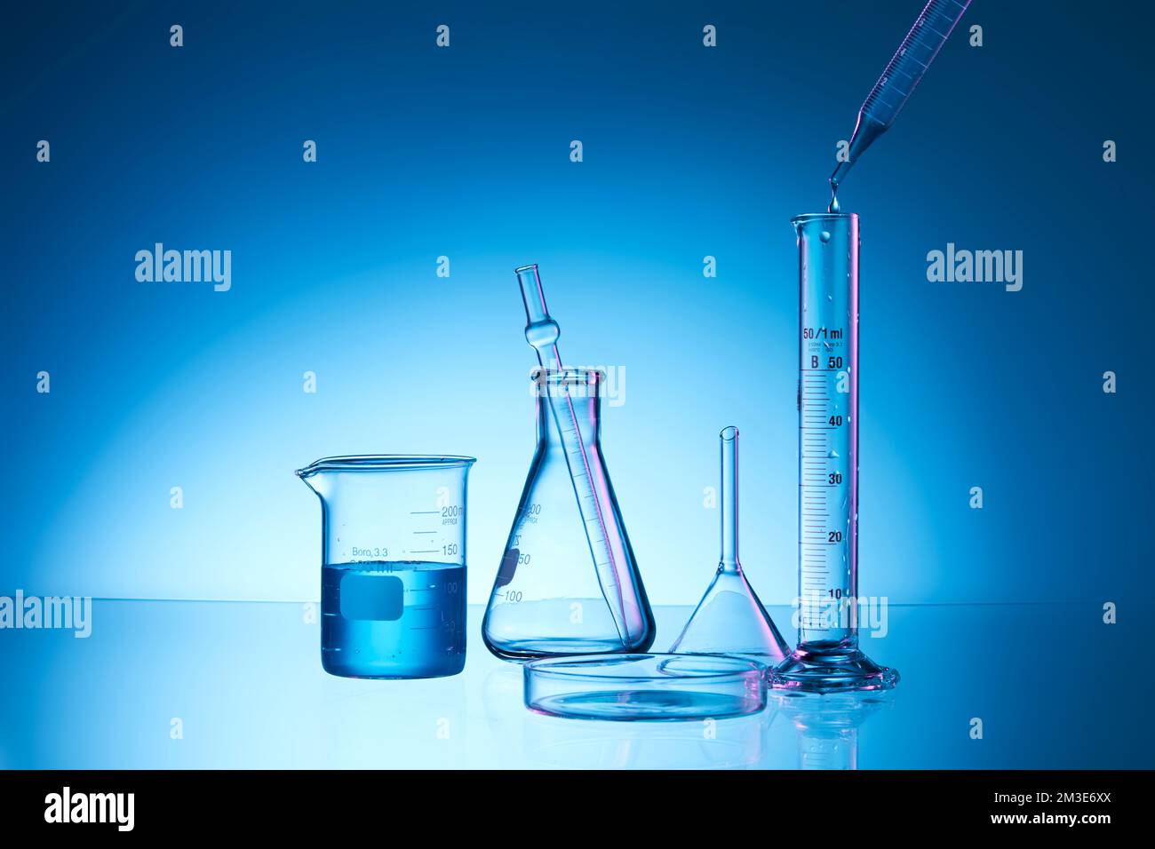 science lab with clear blue background and test tubes with blue ...