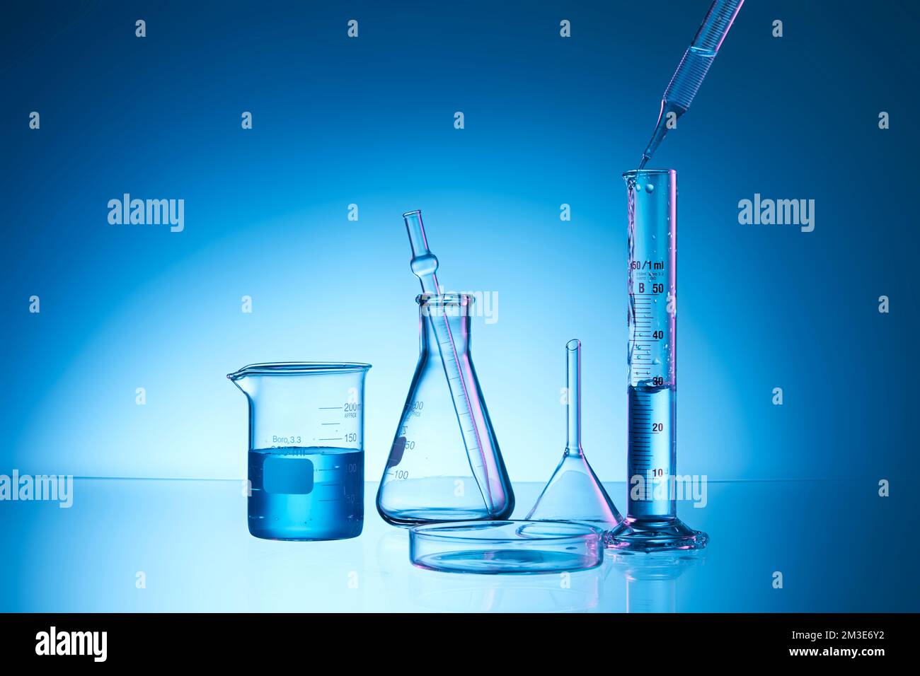 science lab with clear blue background and test tubes with blue ...